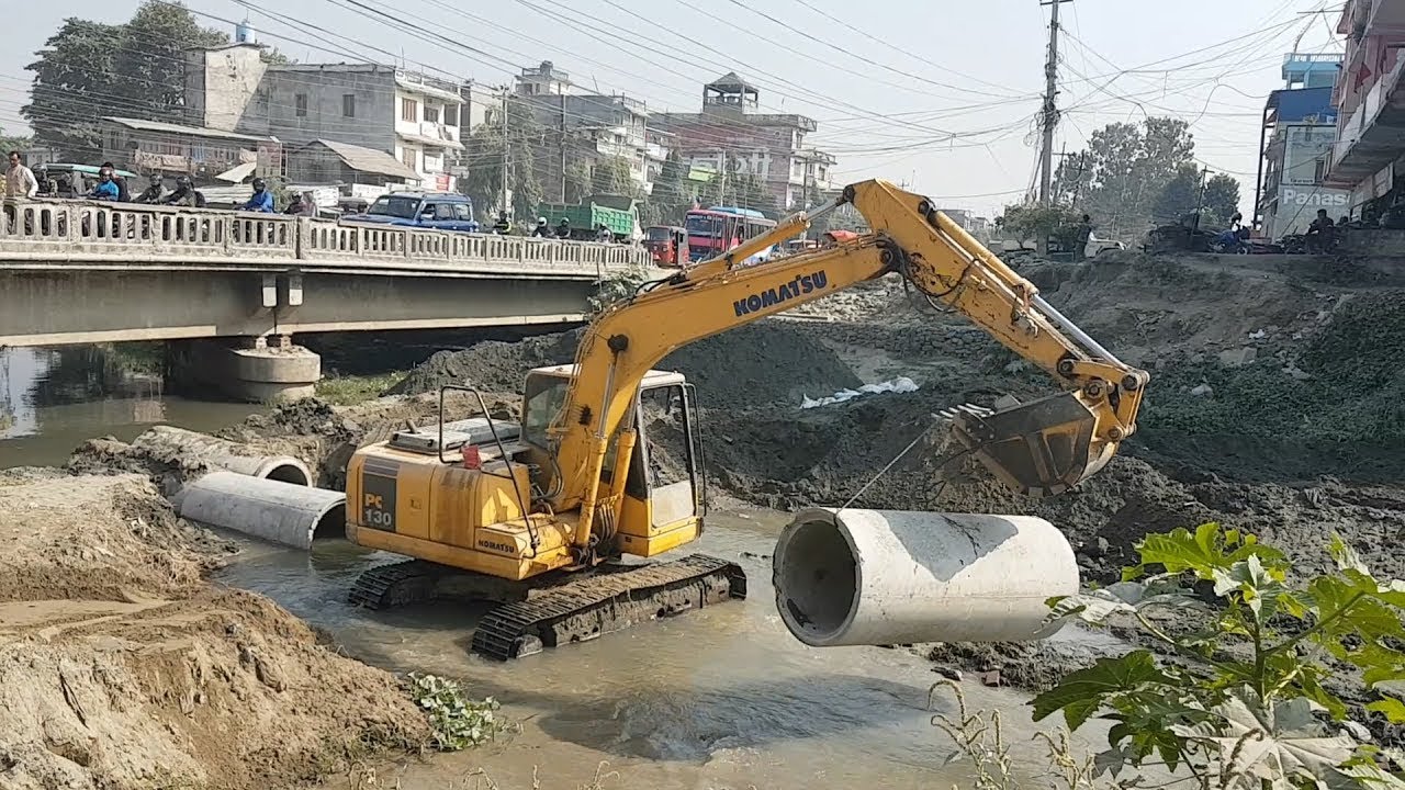 Komatsu pc300 Excavator Loading Rcc Pipe & Shifting In river for ...
