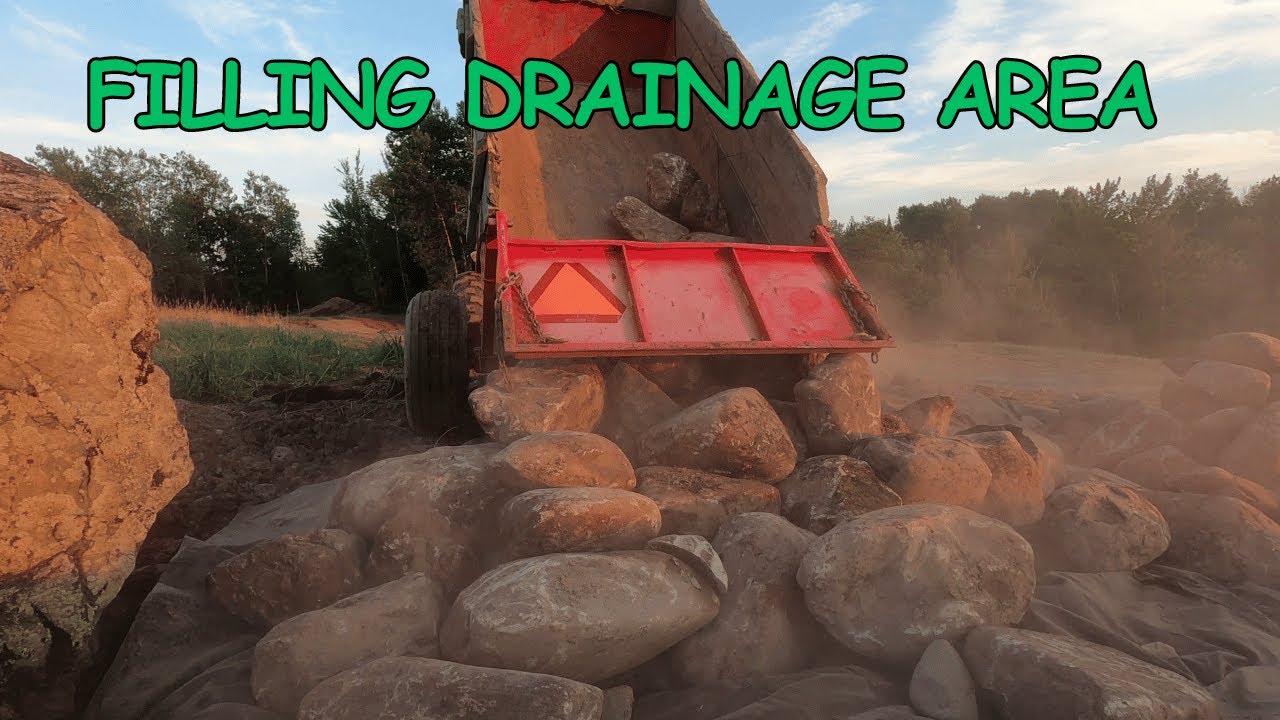 Making a road in a field - Part 19 | Using an old rock wall to fill ...