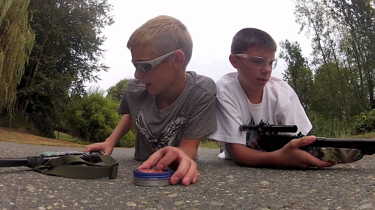 Shooting full coke cans with Pellet Guns. - YouTube