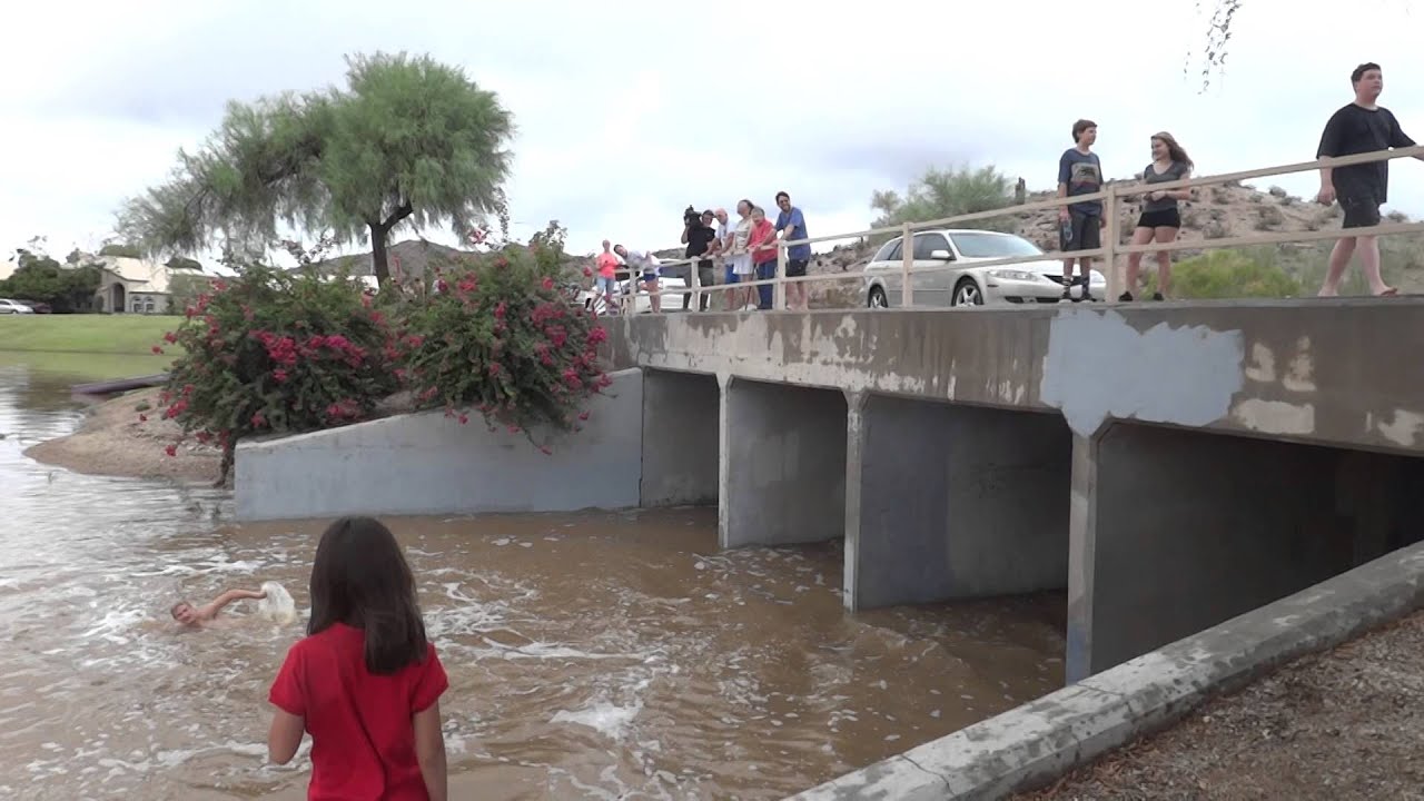 Kids Jumping Into Flood Waters - YouTube