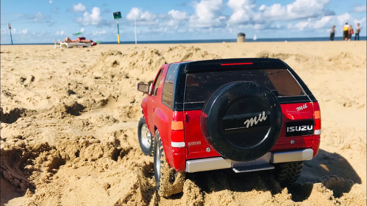 Isuzu MU on a CC01 chassis from Tamiya on the beach. - YouTube