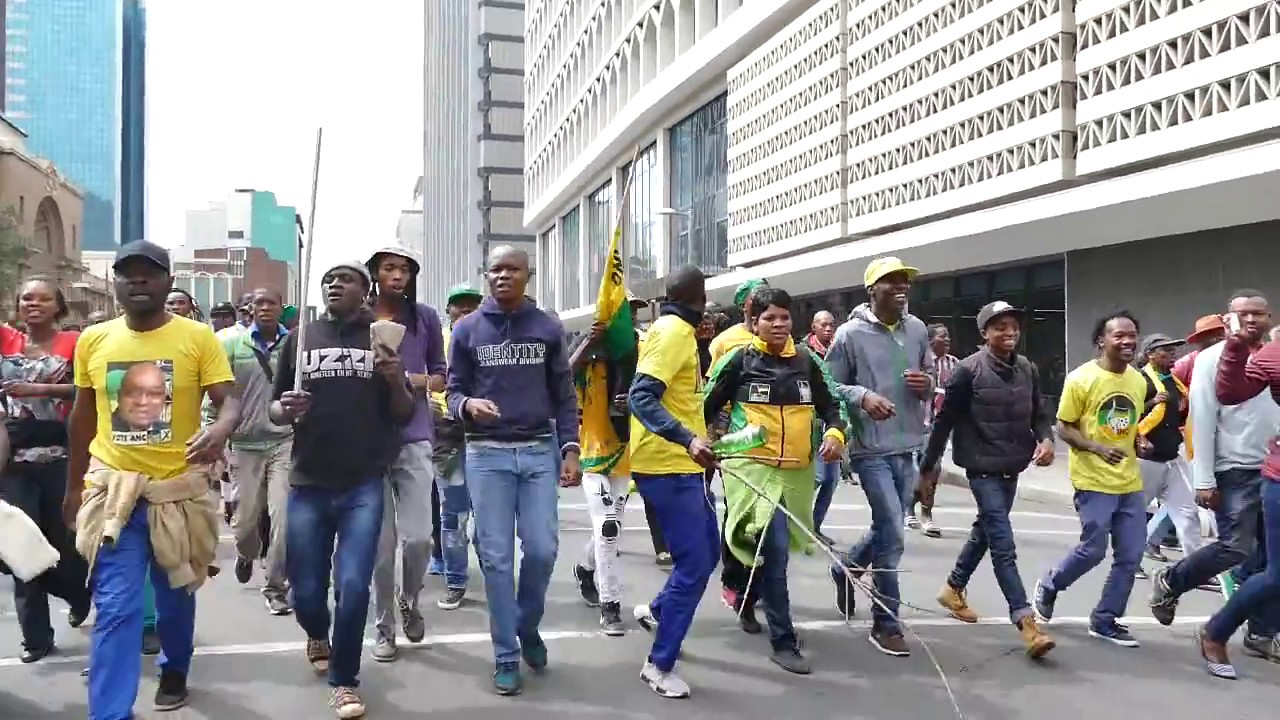 ANC protesters making their way through the streets of Johannesburg ...