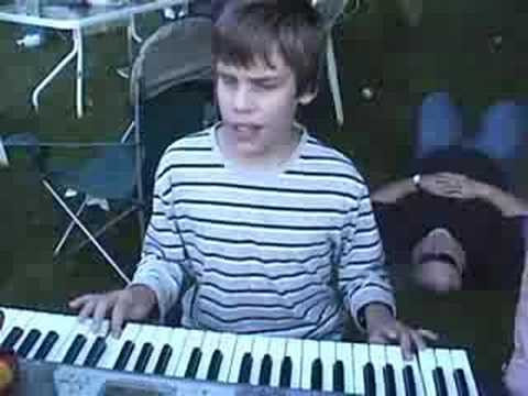 Blind child Patrick B, playing keyboard and singing. - YouTube