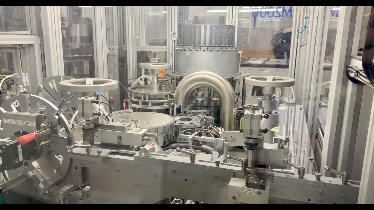 Spring Feeding and Assembly Machine - YouTube