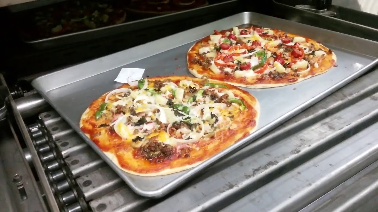 How Itallian Pizza is made using mechanized Oven. - YouTube