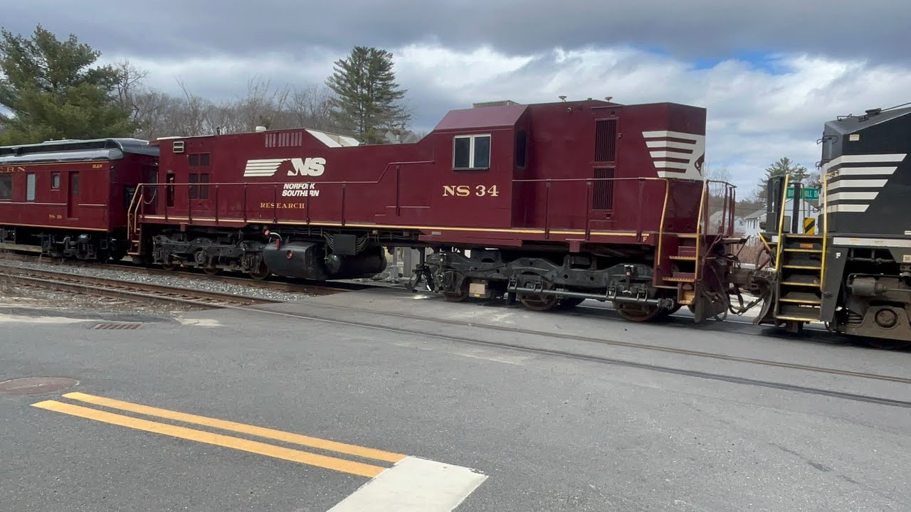 A Strange Looking Beast Inspects the Rails on an Even Stranger Railroad ...