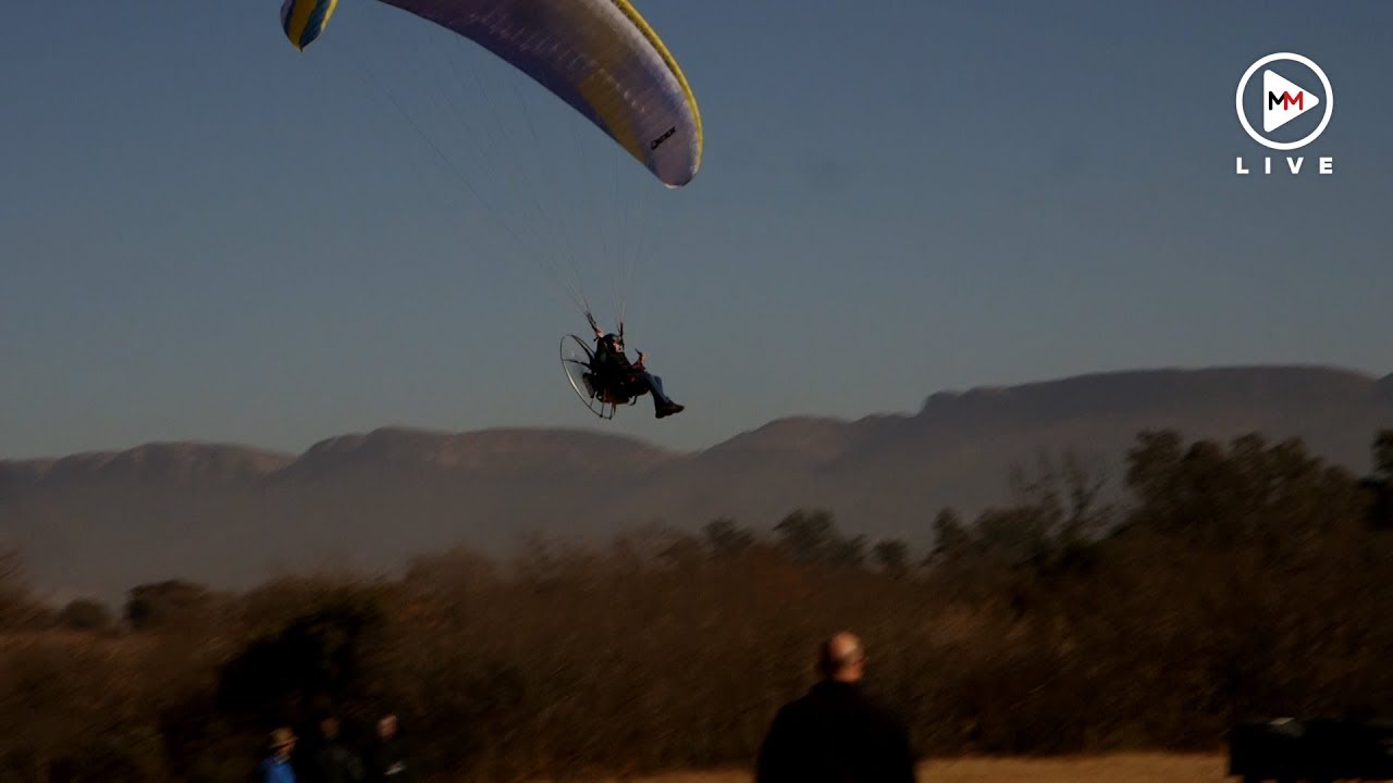 One parachute plus one lawnmower engine = a flight from SA to Zimbabwe ...
