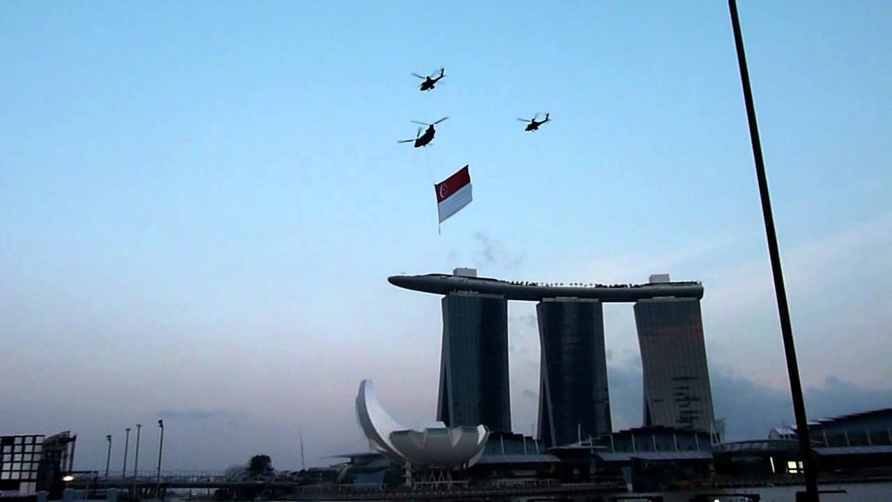 Helicopters flying the flag over - YouTube