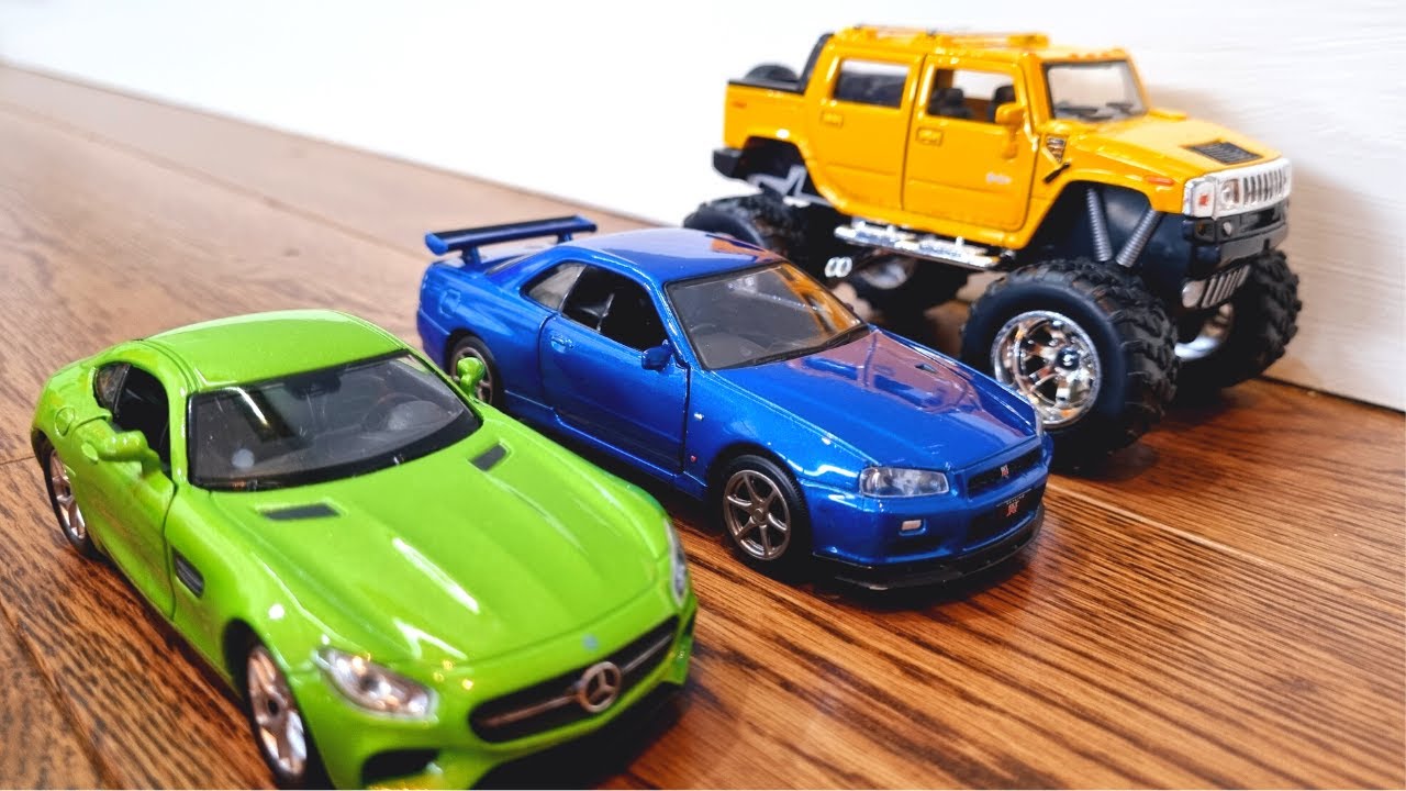 Observing various model alloy cars in dynamics on the floor ...