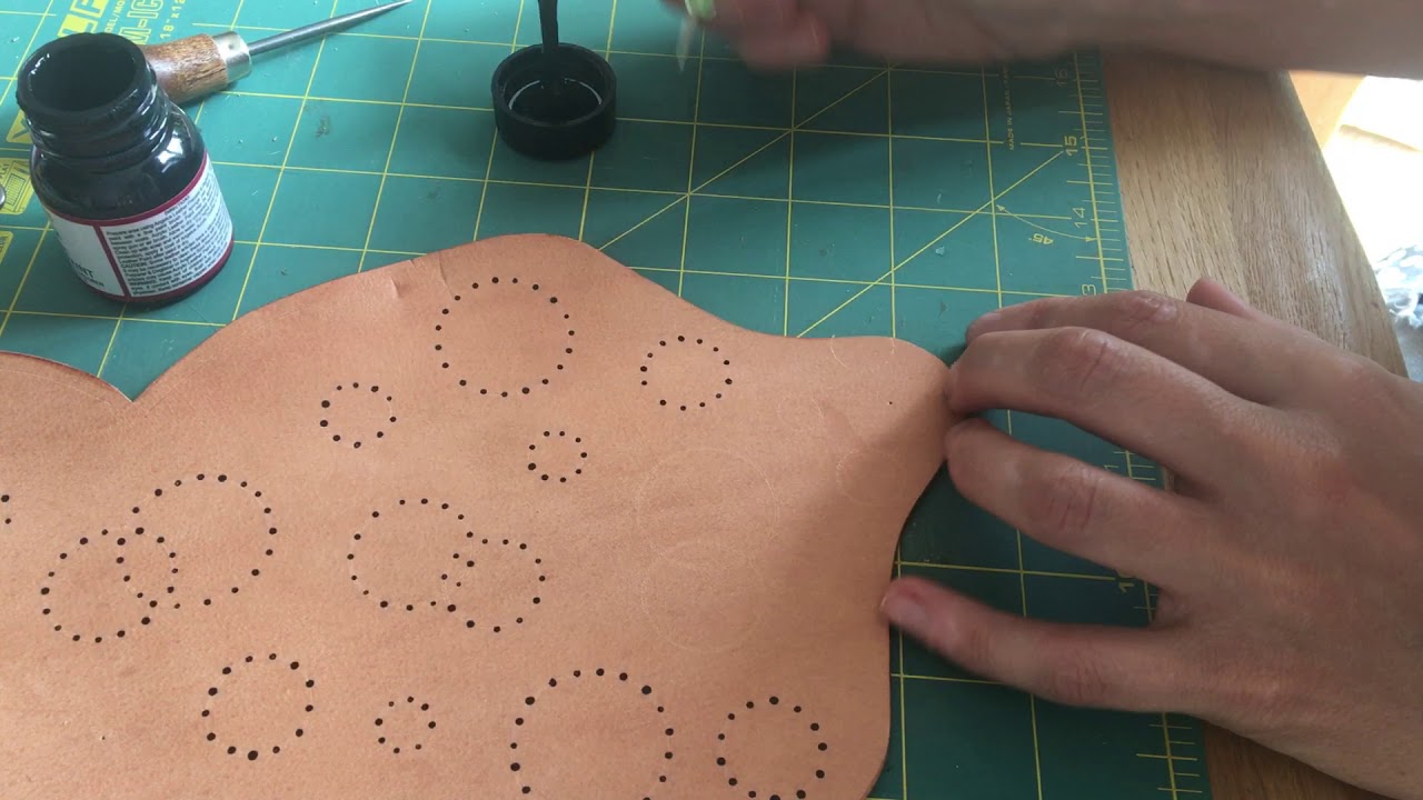 Handpainting dots in circle pattern onto leather with acrylic paint and ...