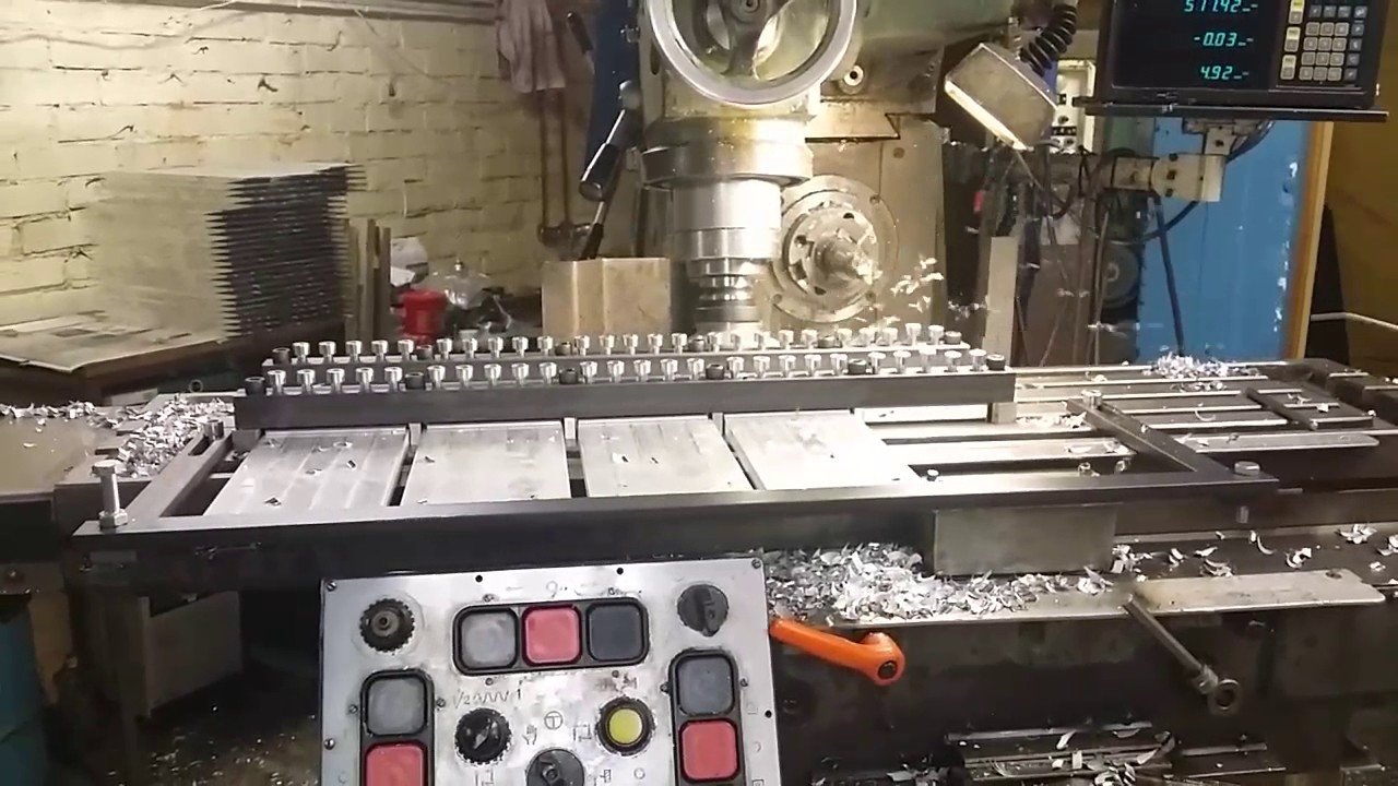 Heavy manual milling on a production setup - YouTube