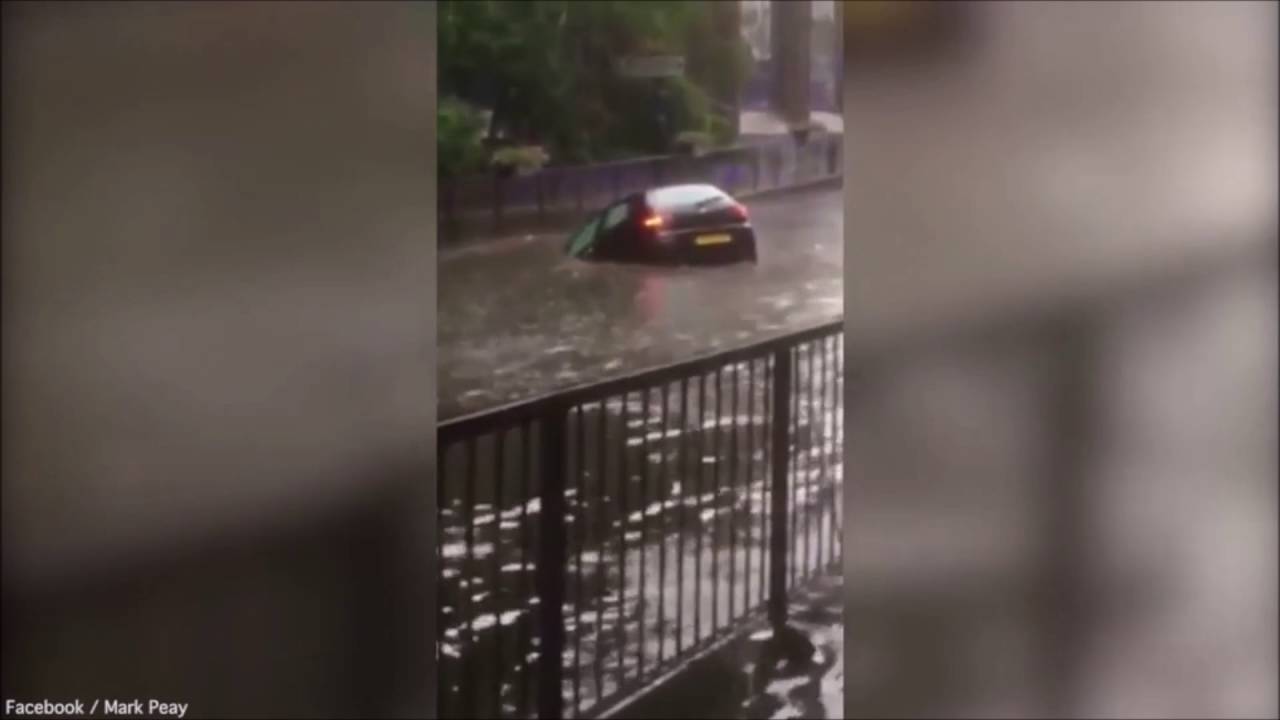 Cars sink underwater after flash flood hits Wallington - YouTube