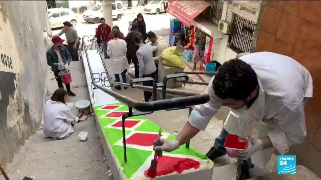 Algerian students paint walls as new way of peaceful resistance - YouTube