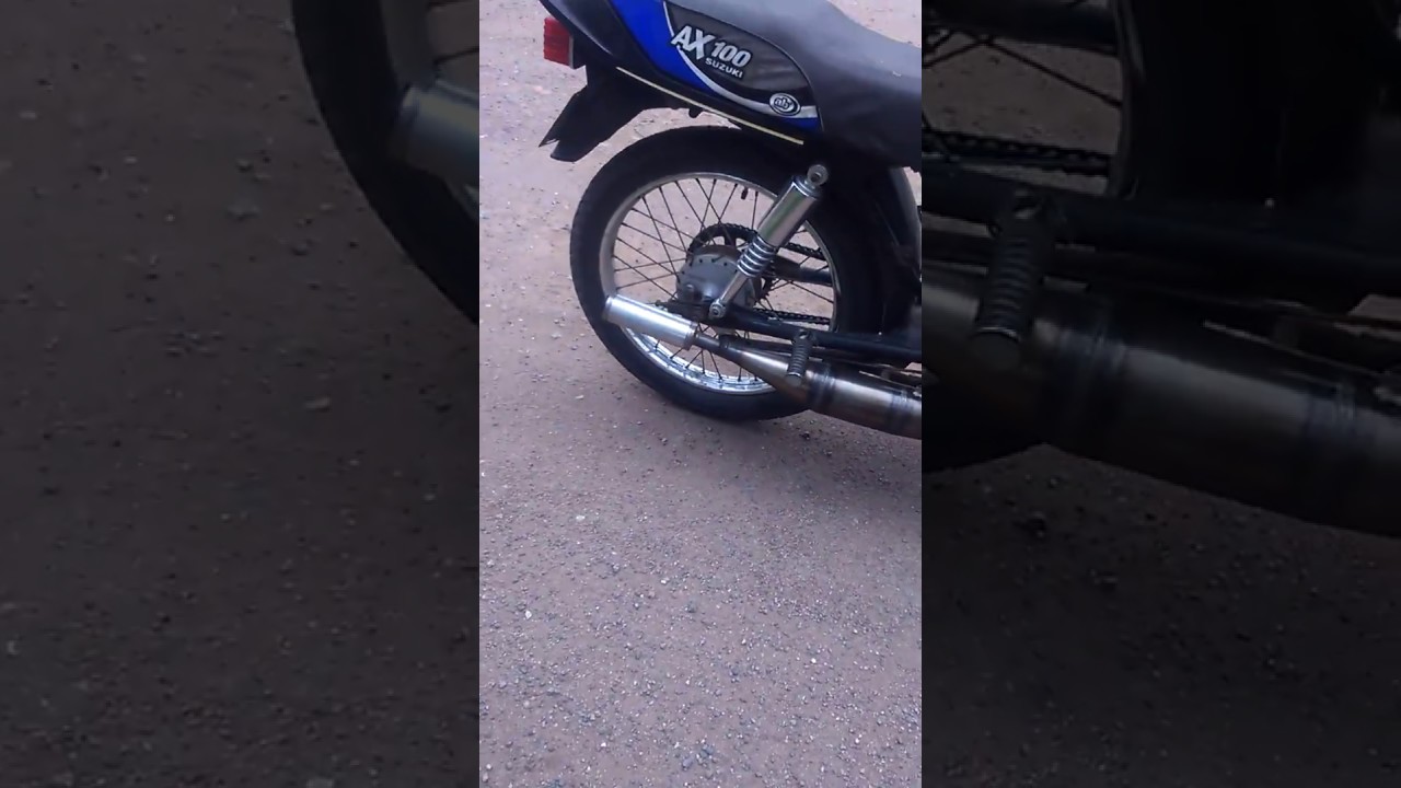 Escape competicion - Suzuki ax 100 - YouTube