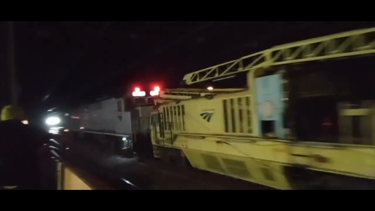 Amtrak MOW train rolls southbound past Newark DE Station on 3-20-23 w/ 526/520 & bonus Crane ...