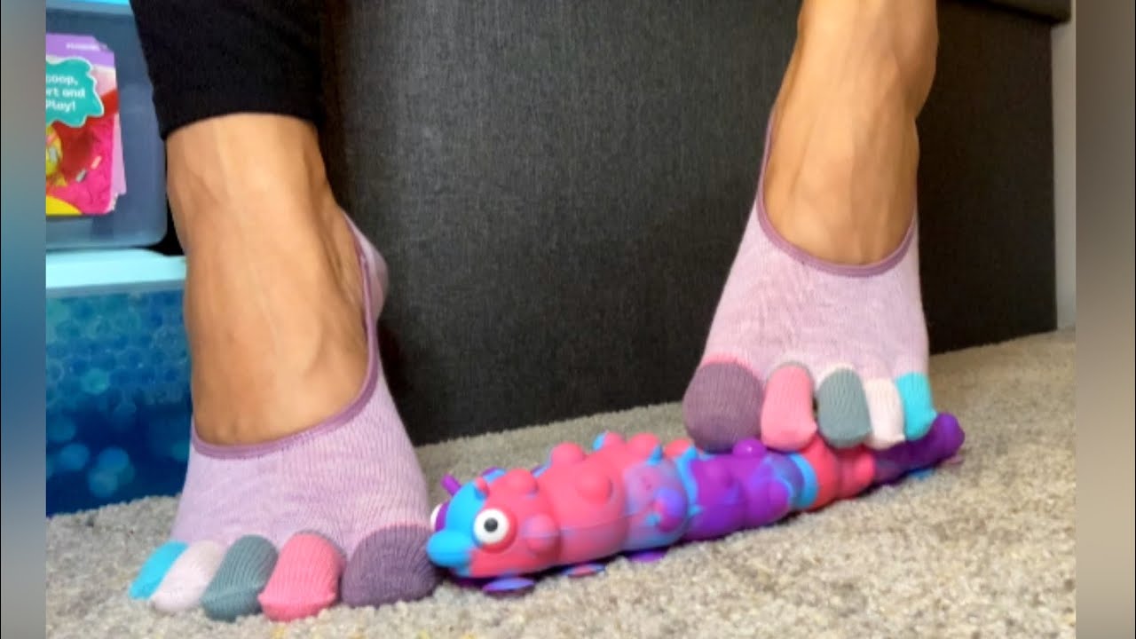 Feet crushing pop it toy wearing toe socks - YouTube