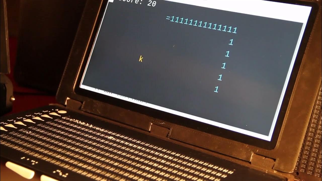 The prototype Canute Console programming Snake in Python... in multiline refreshable Braille ...