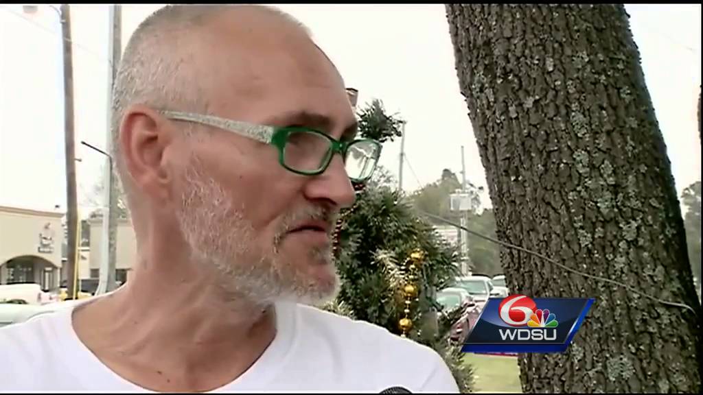 Homeless man with Christmas tree forced to move from expressway after ...