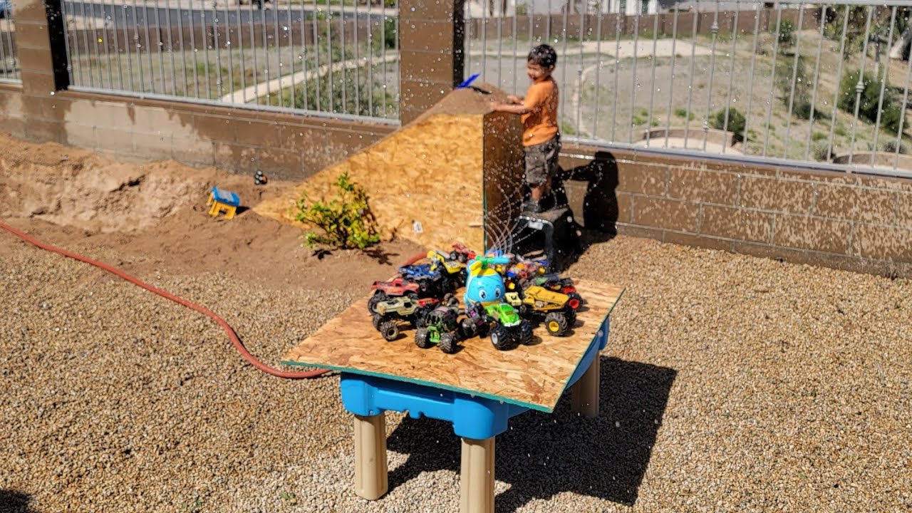Toy Monster Trucks Ramping Over Helicopter Sprinkler!!! Awesome - YouTube