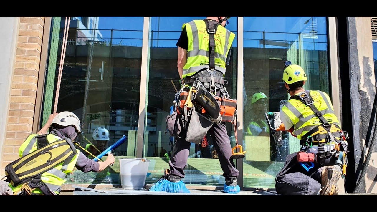 Spider Rope Access Crawling Down The Water Spout Using Rope Access ...