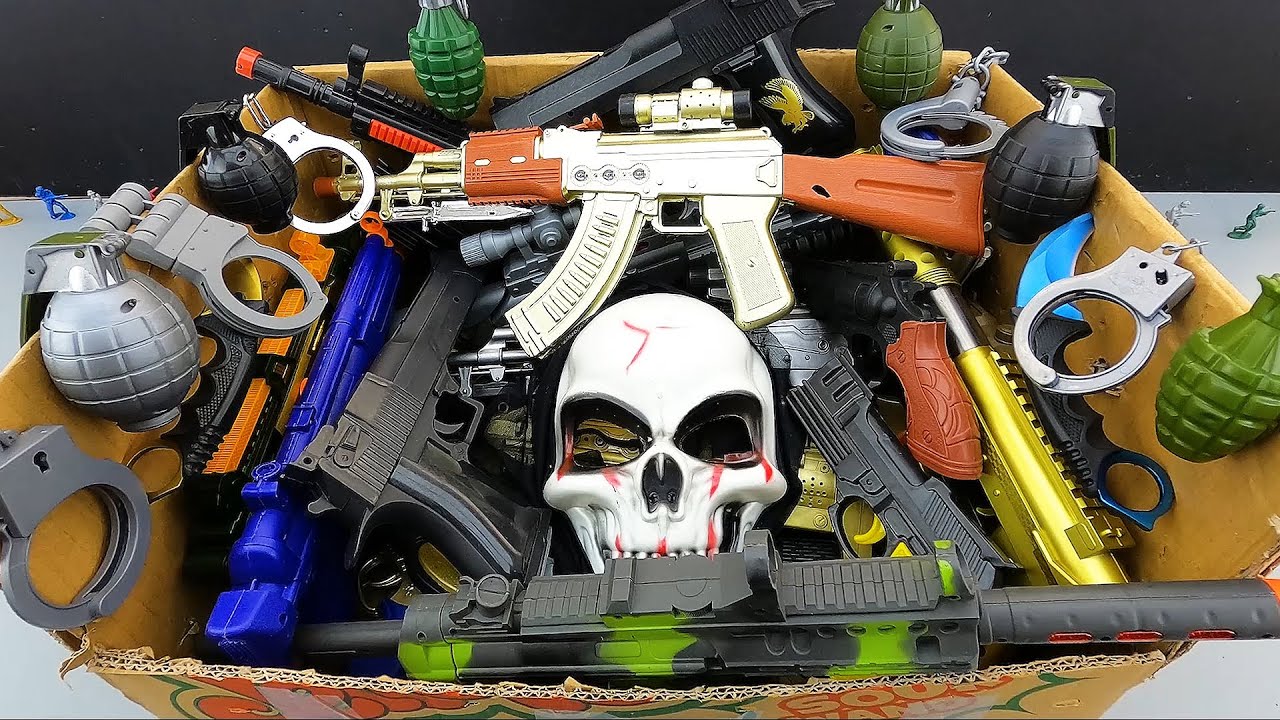 Box Of Toy Guns, Scary Skeleton Masks, Handcuffs, Grenades And Other ...