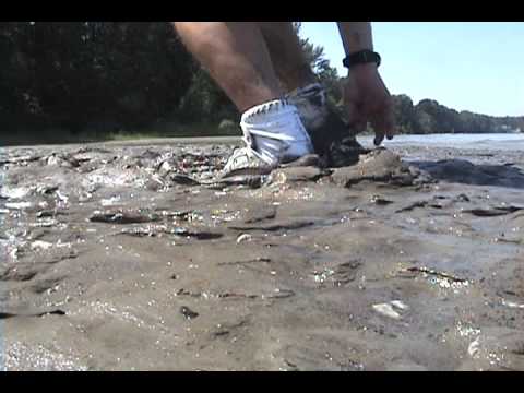 white socks and nikes in the mud