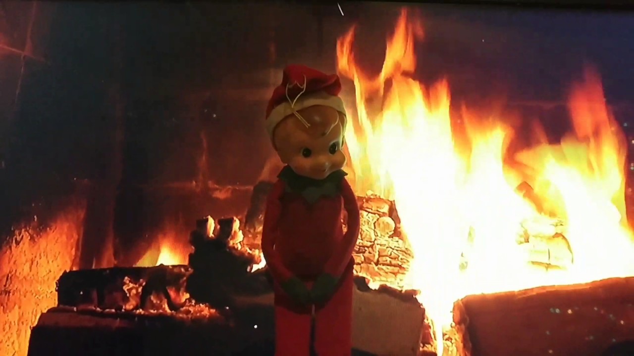 Elf on shelf warming in the fire!! - YouTube