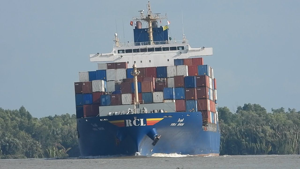 Massive Container Ship Loaded with Containers Navigating Through the S ...