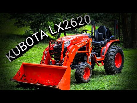 Kubota LX2620 pulling logs in the snow. - YouTube