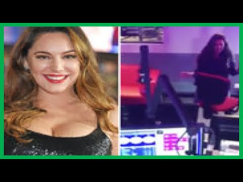 Kelly Brook writhes around in raunchy dance on spinning chair in behind-the-scenes video