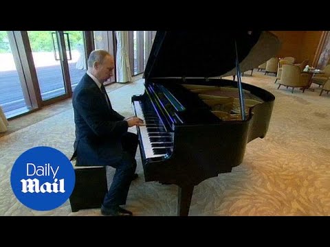 Putin on a show: Russian president shows off his piano skills - Daily Mail