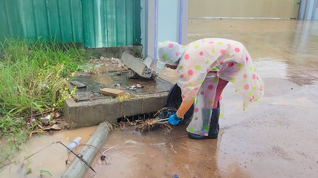 Unclogging Drain On Street Cleaning Rubbish Stuck In Culvert Drain ...