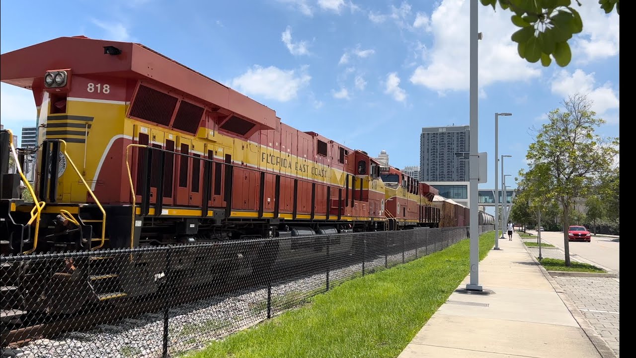 Fec 206 with a lashup. Leads thru brightline station with 811 leading ...