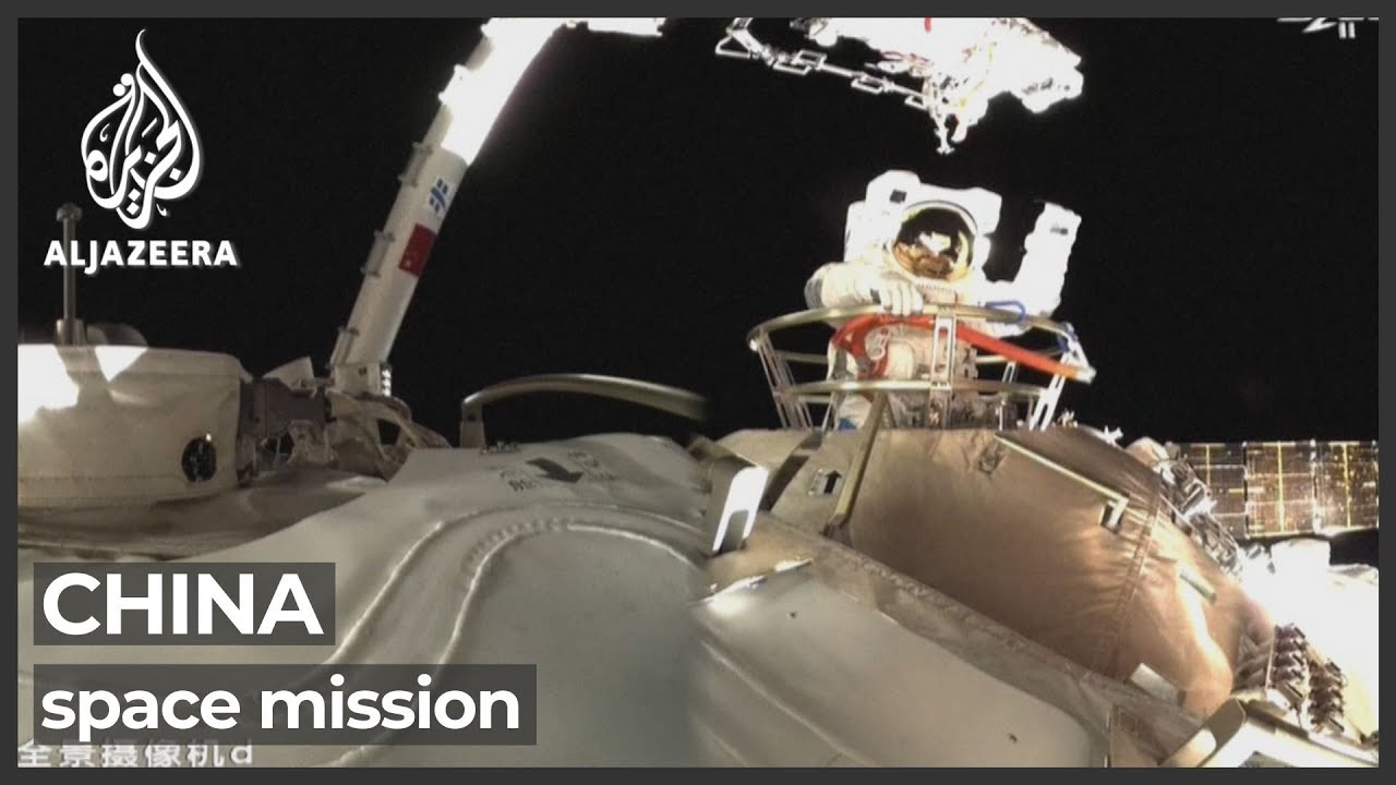 Chinese astronauts complete first spacewalk from new station - YouTube