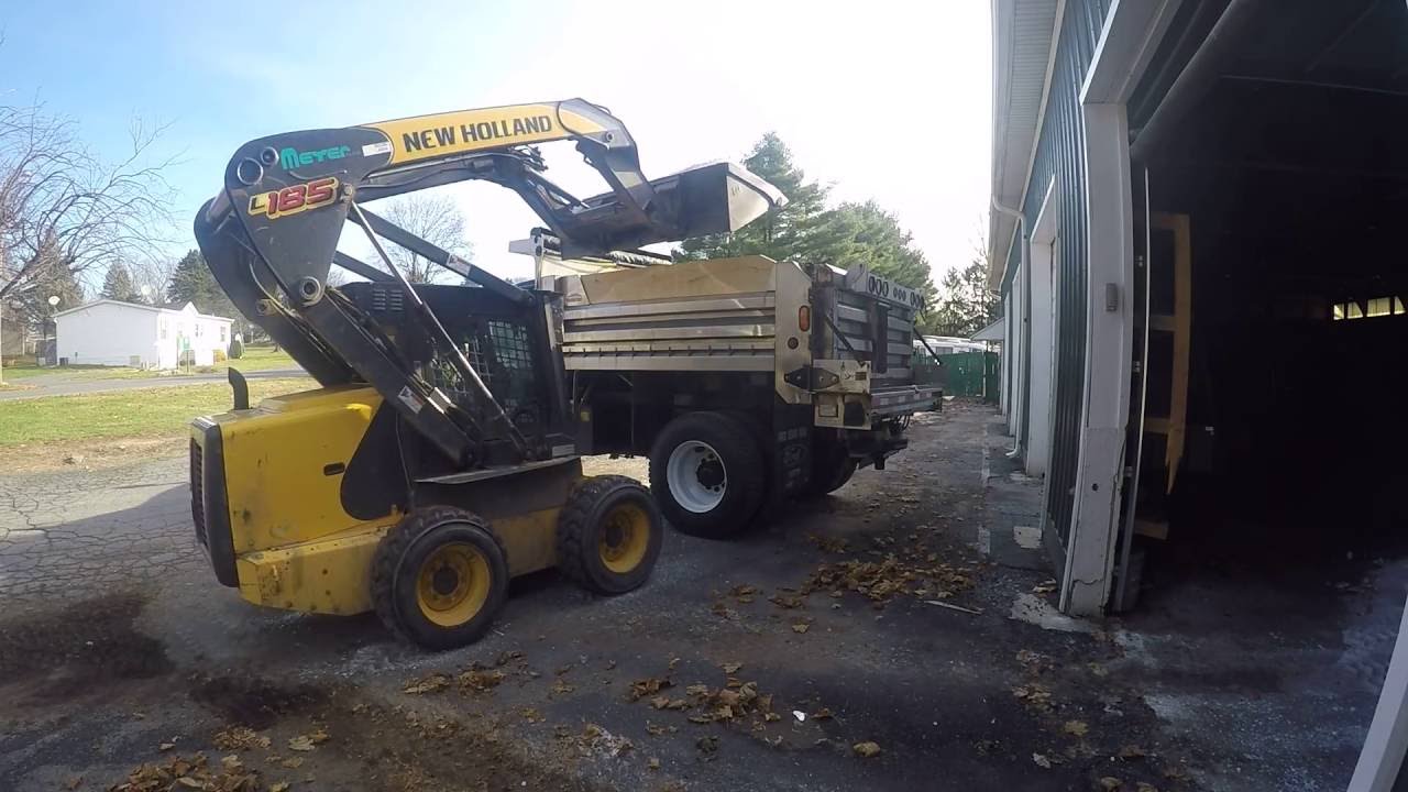 Skidsteer loading salt in F750 Salt Truck - - YouTube