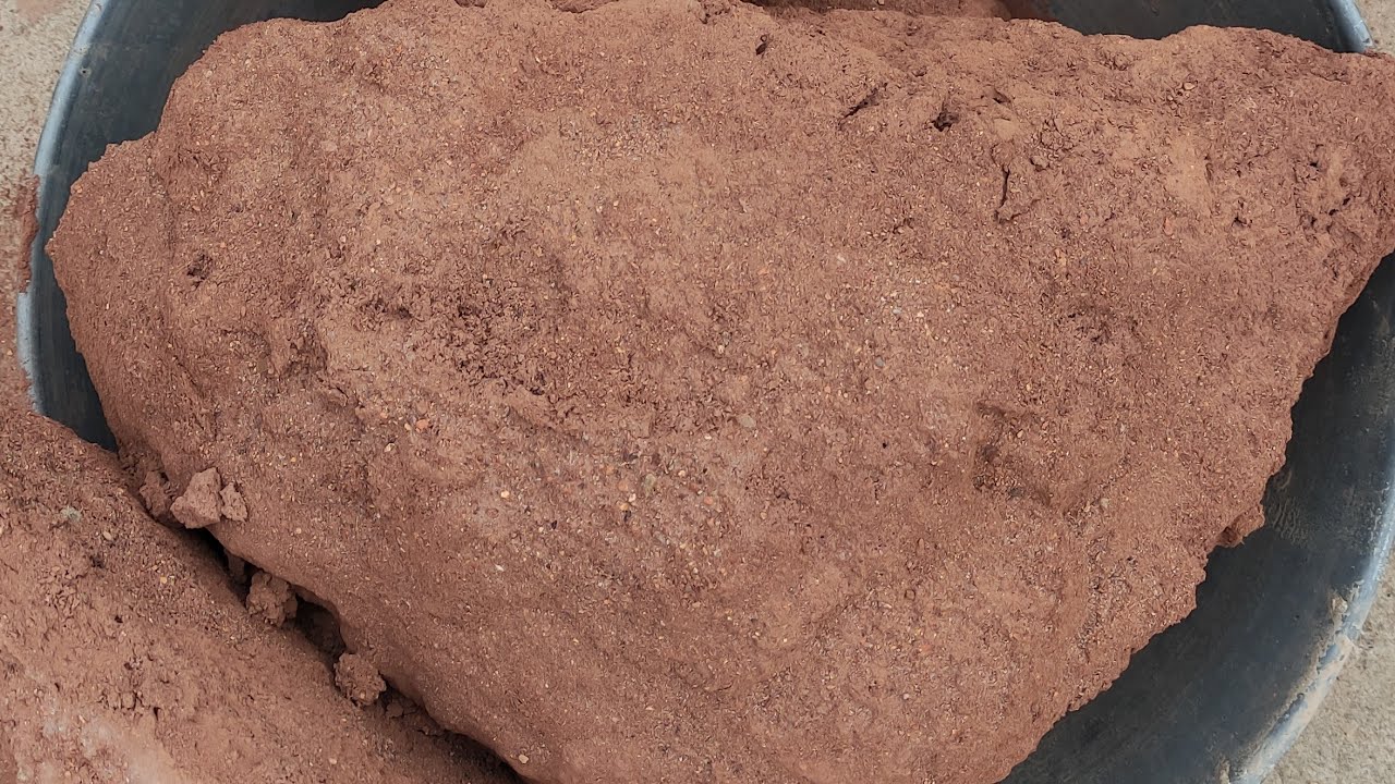 Pure red dirt Giant Chunks dry crumbling with Pouring of reddirt in ...