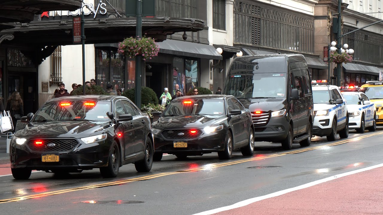 Counter terrorism convoy patrols New York, and other police cars in the ...
