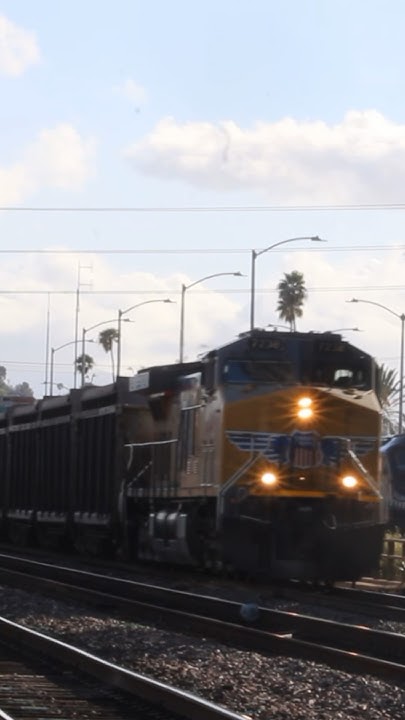 UP 7238 leads an Eastbound Rock train past the Riverside searchlights - YouTube