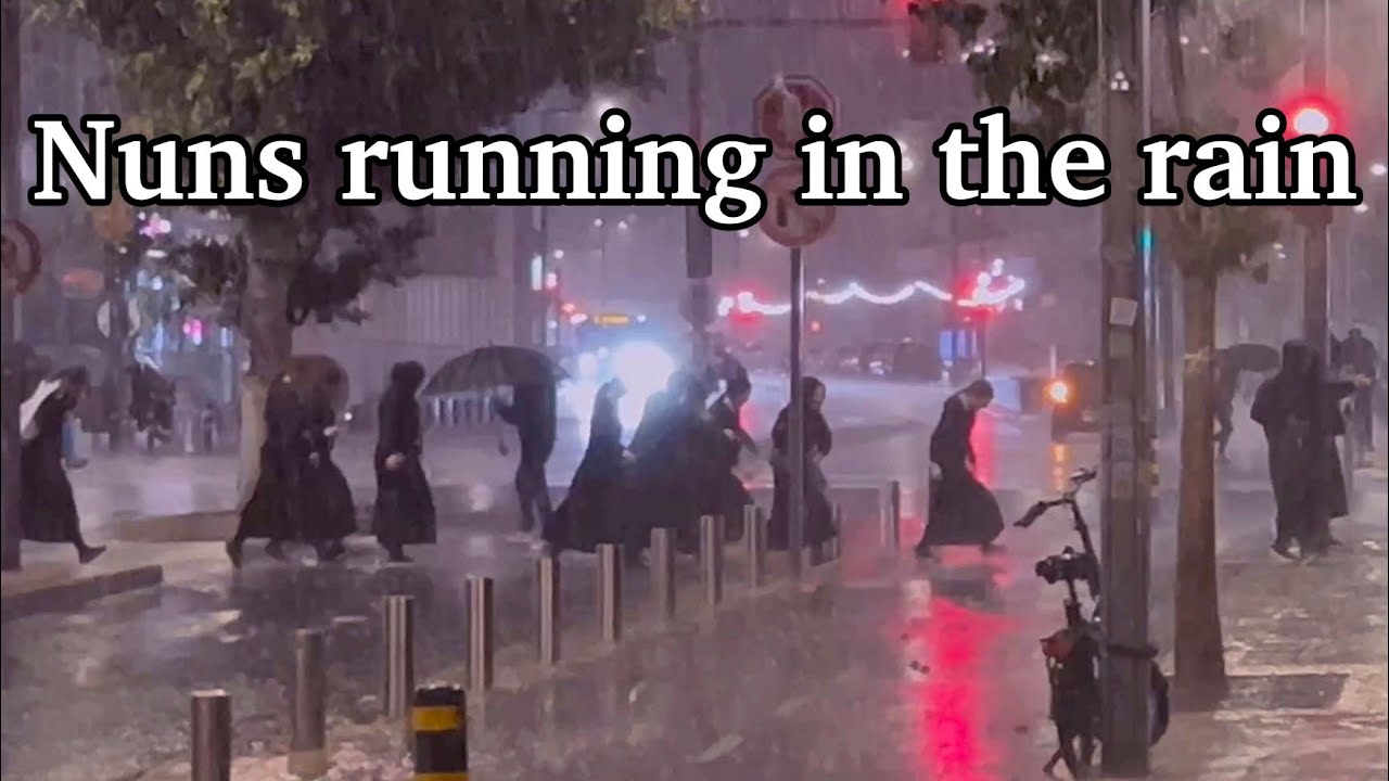 Nuns seeking shelter for the rain in Tel Aviv - YouTube