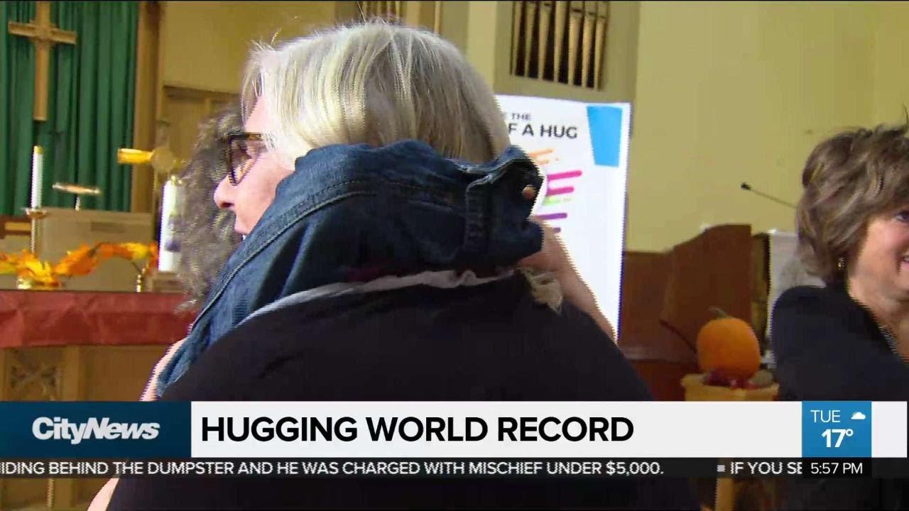 Group attempting to break hugging world record - YouTube
