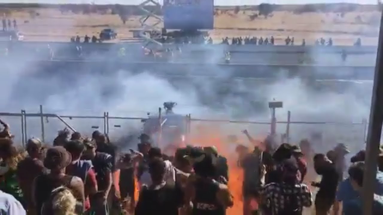 Crowds sprayed with burning fuel at a drag racing event - YouTube