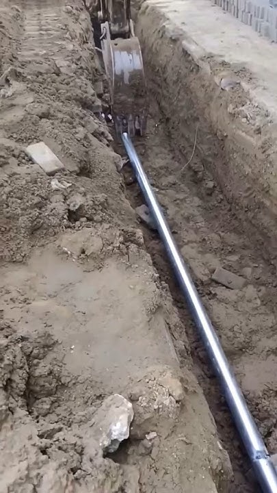 Excavator underground pipe installation process - YouTube