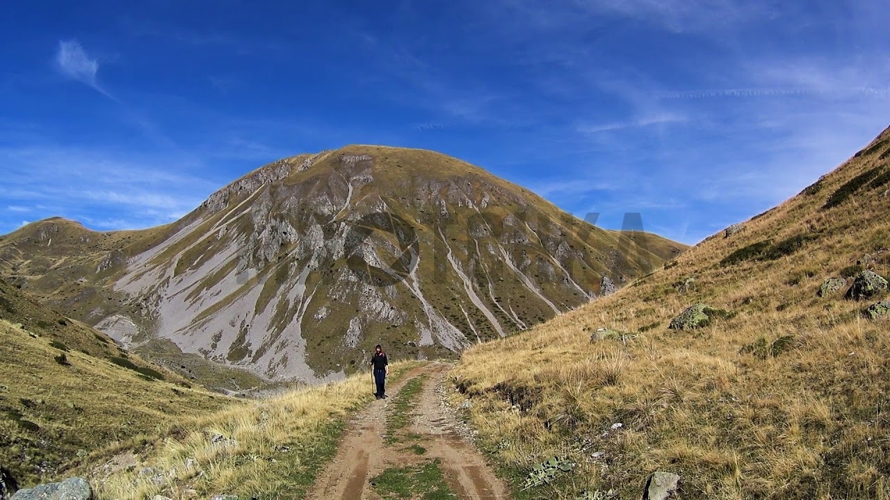 Stock footage: Young woman hiking in Macedonian mountains near ...