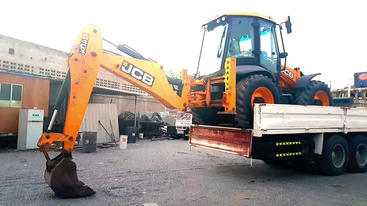 JCB Unloading From Truck in 2 min - YouTube