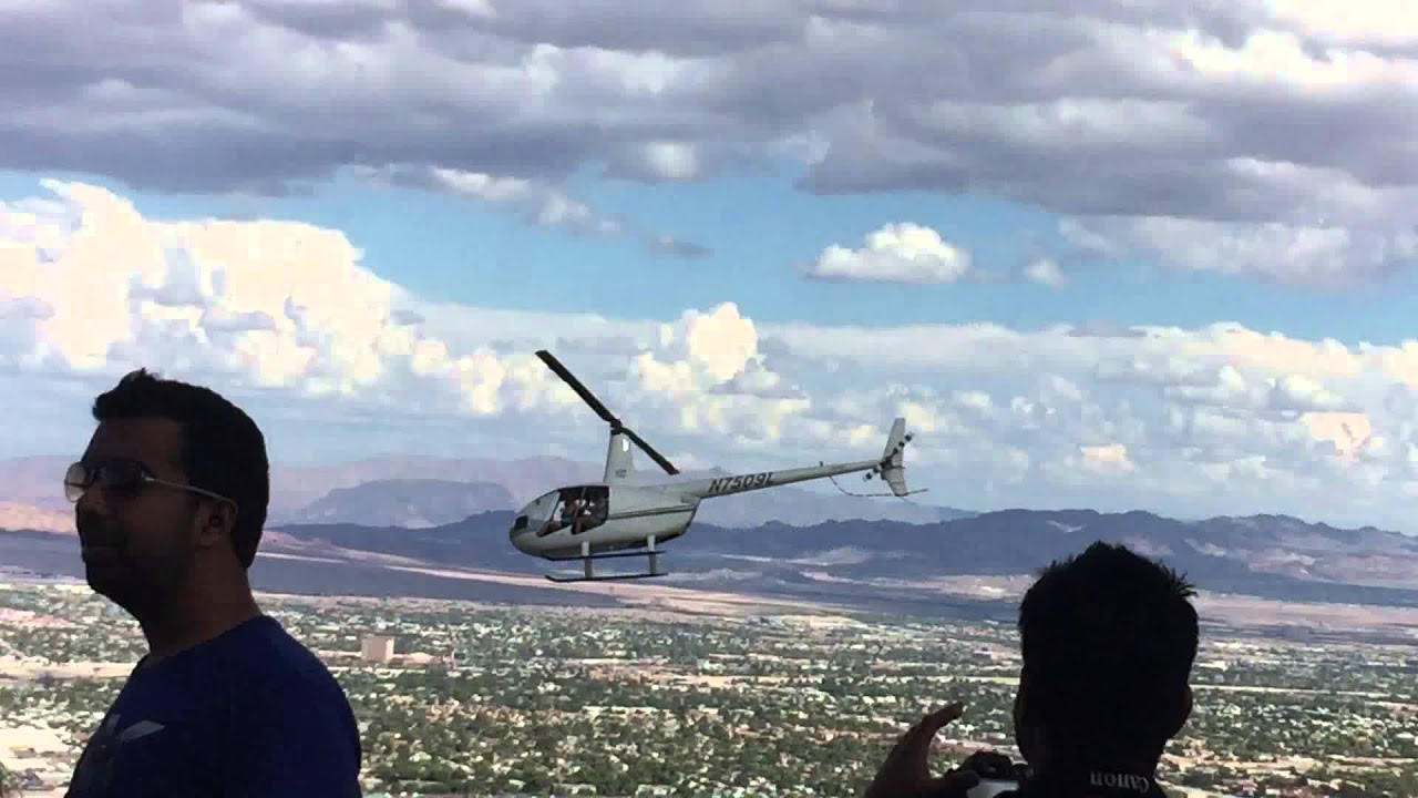 Crazy Helicopter Pilot in Action at Las Vegas Stratosphere Tower - YouTube