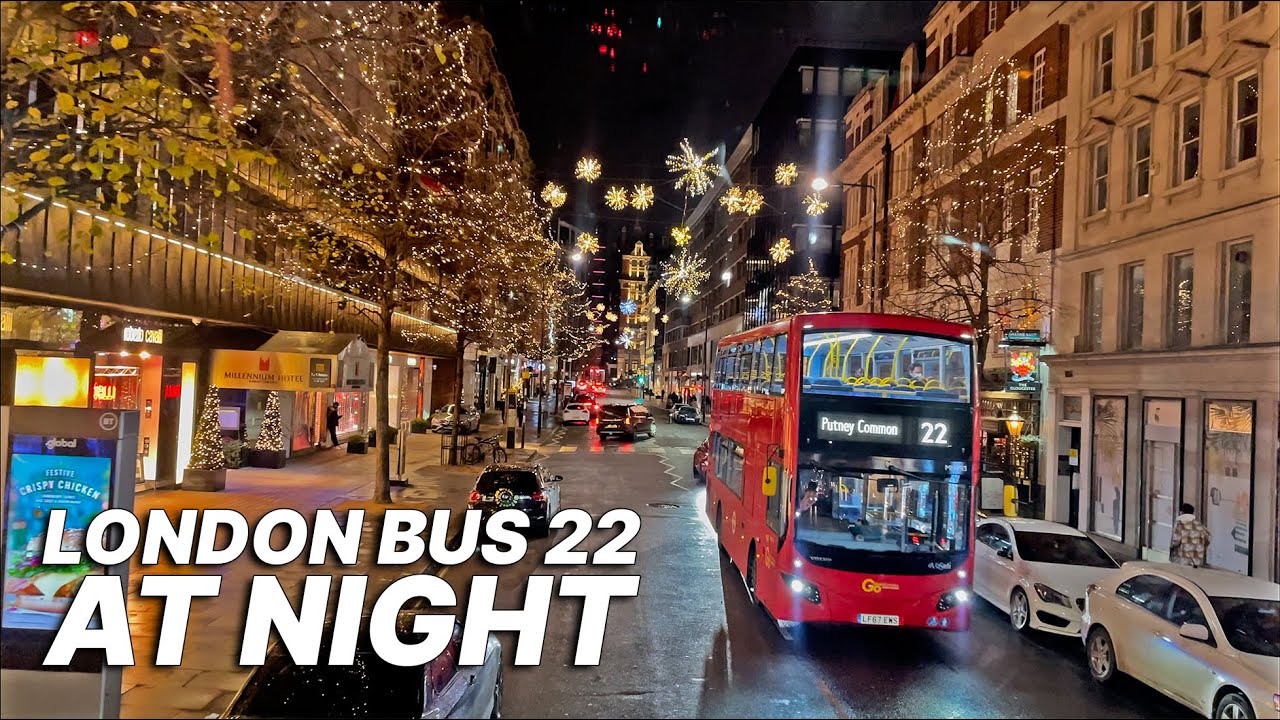 London Bus Route 22 at night, passing festive Chelsea, Sloane Street ...