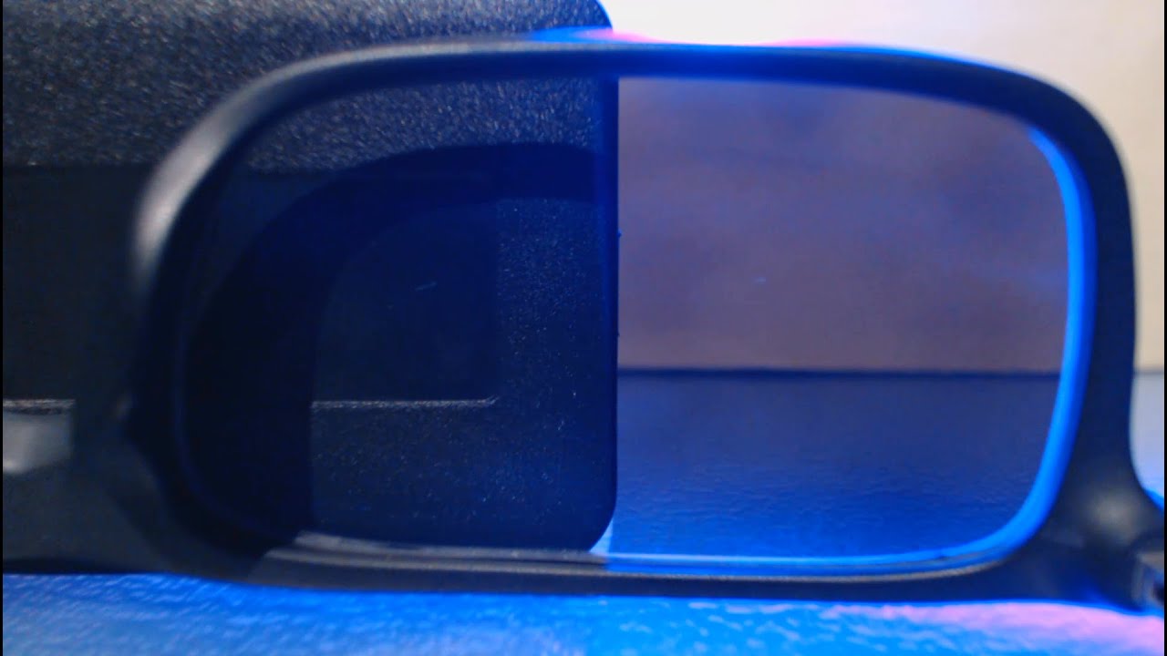 Photochromic (Transitions Signature VII) lens under UV light for 1 min ...