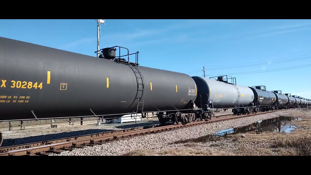 UP 8130 leads Northbound empty tanker train - YouTube
