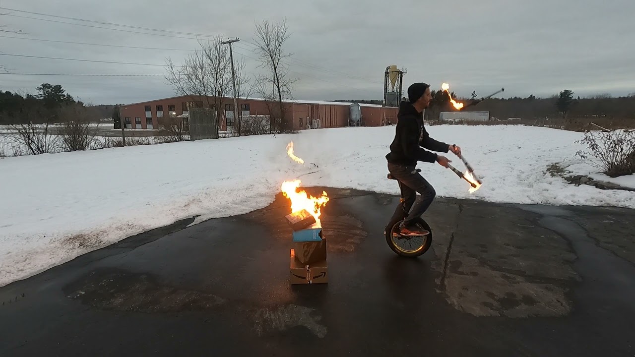 Juggling Fire, Starting a Fire and Putting Out a Fire On a Unicycle ...
