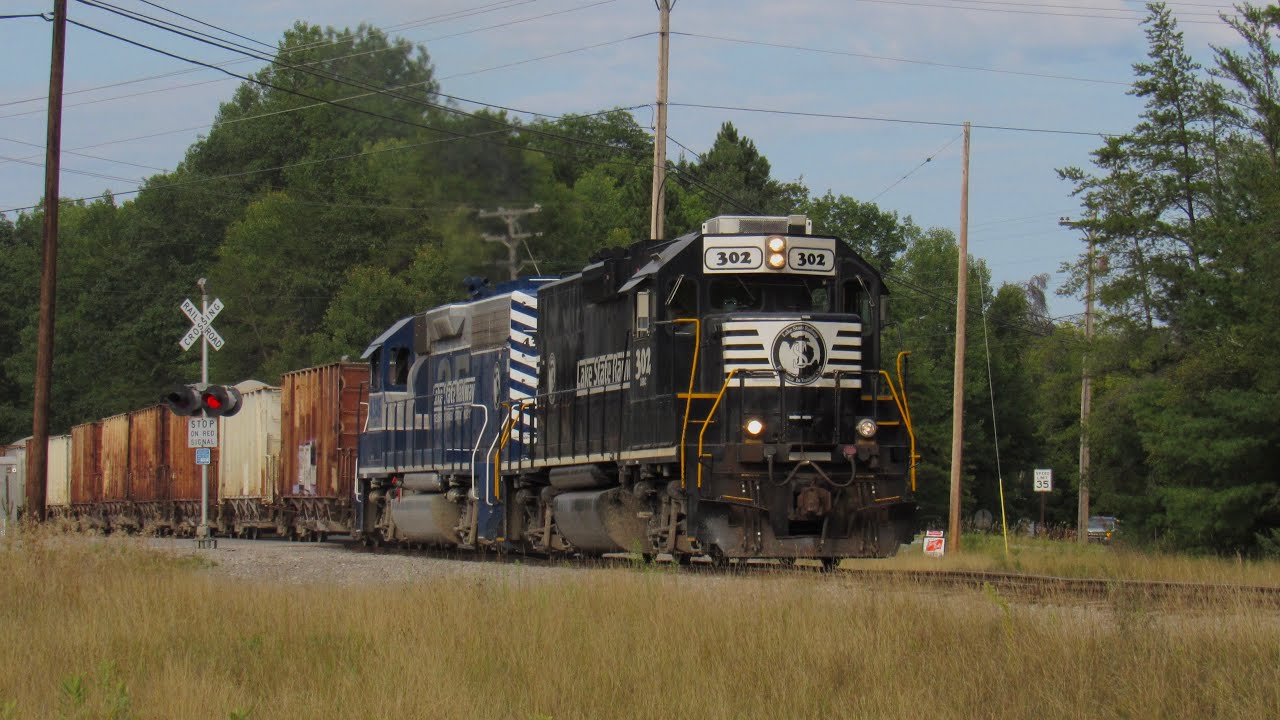 LSRC 302 and LSRC 4325 departing the LSRC Alpena yard and passing Werth Rd with Train 326S ...